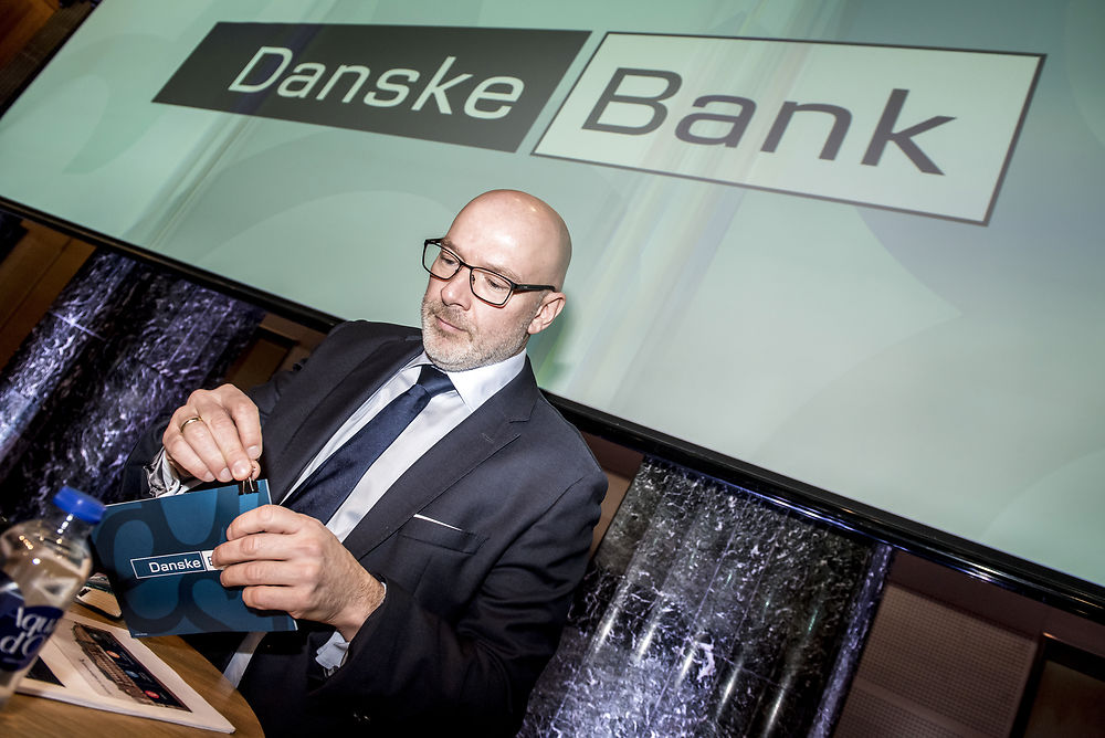 Scandal-hit Danske Bank vows tighter controls as profit tumbles